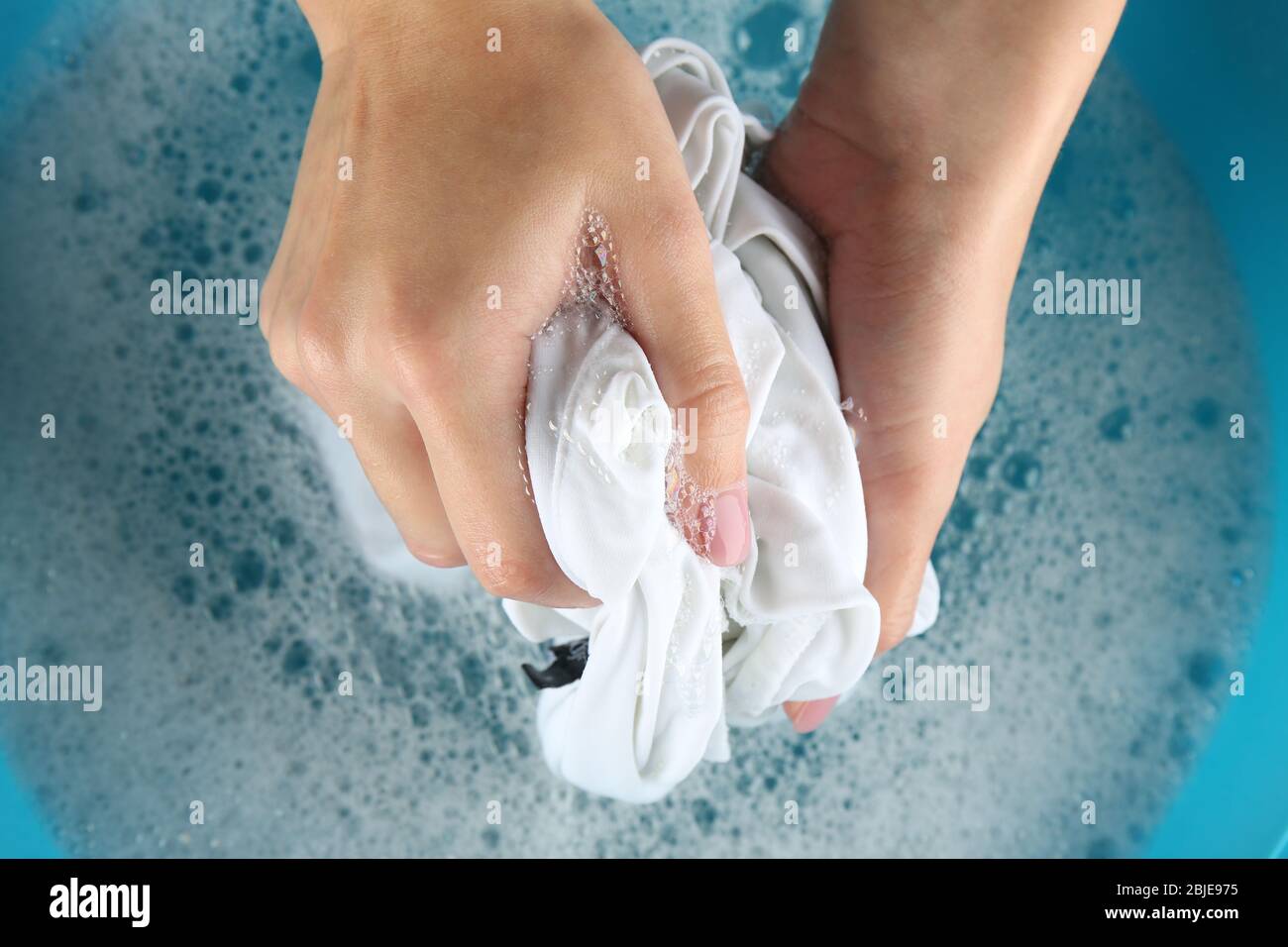 Clothes in basin hi-res stock photography and images - Alamy