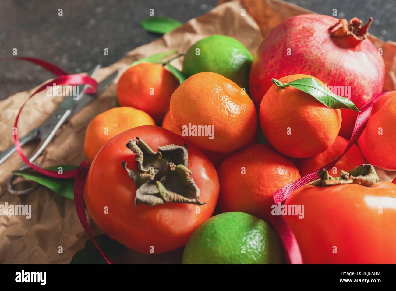 Set of tangerines and juice fruits on wrapping paper Stock Photo - Alamy