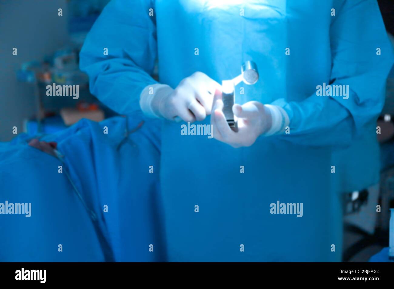 Surgeon with medical tools in operating room Stock Photo - Alamy