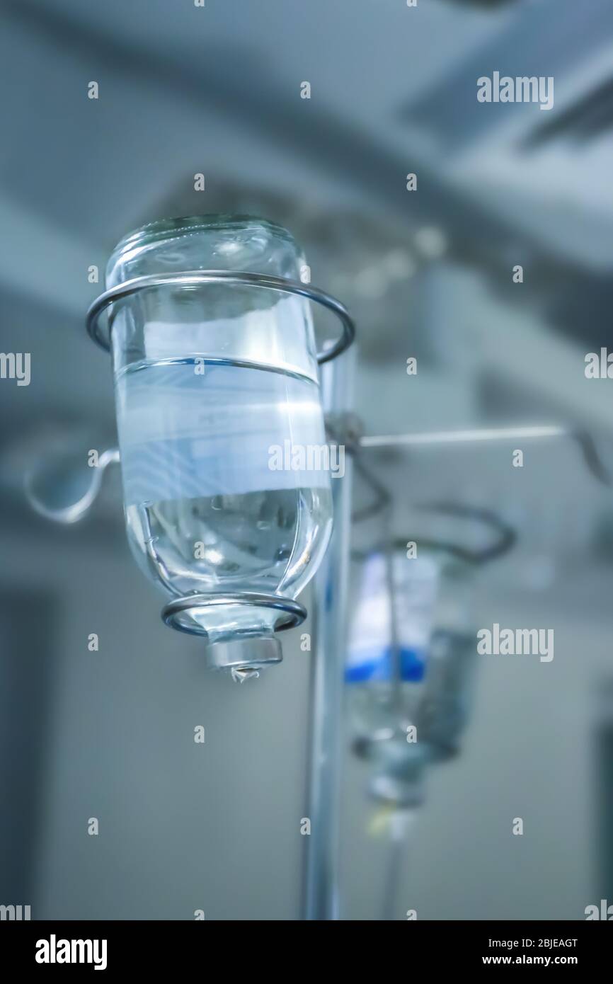 Infusion drip in hospital on blurred background Stock Photo - Alamy