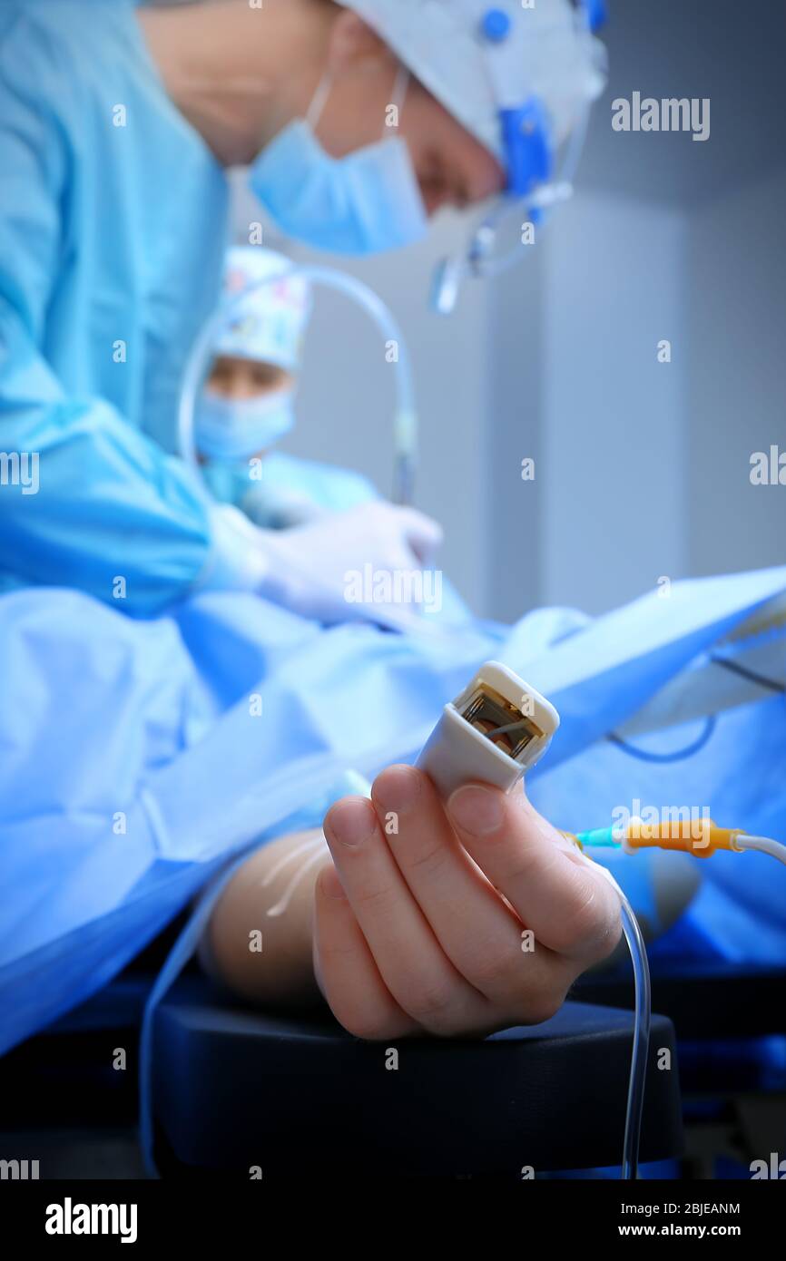 Operation of patient in modern hospital Stock Photo - Alamy