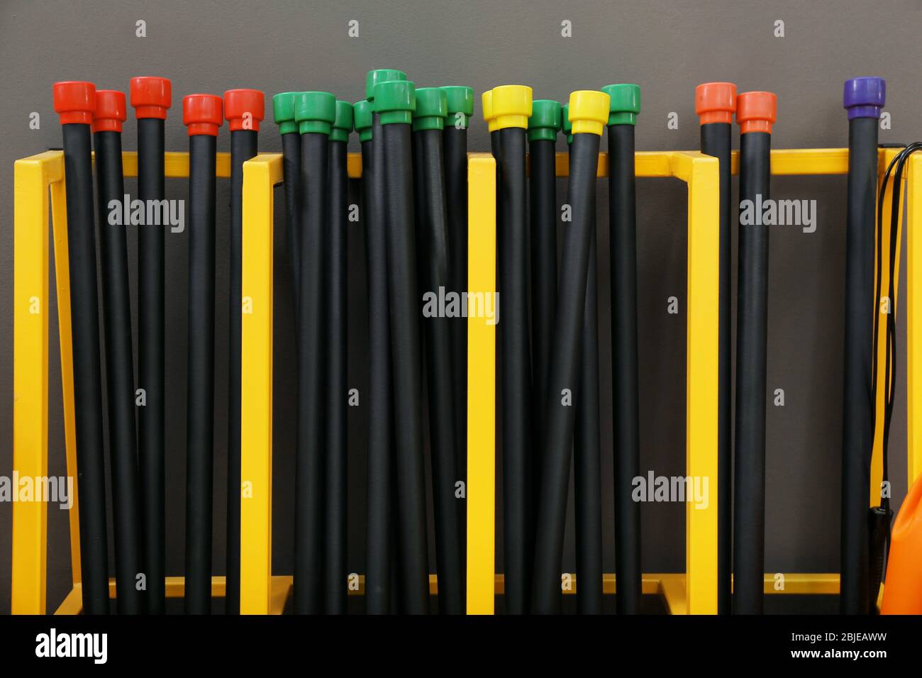 Set of body bars for fitness in gym Stock Photo - Alamy