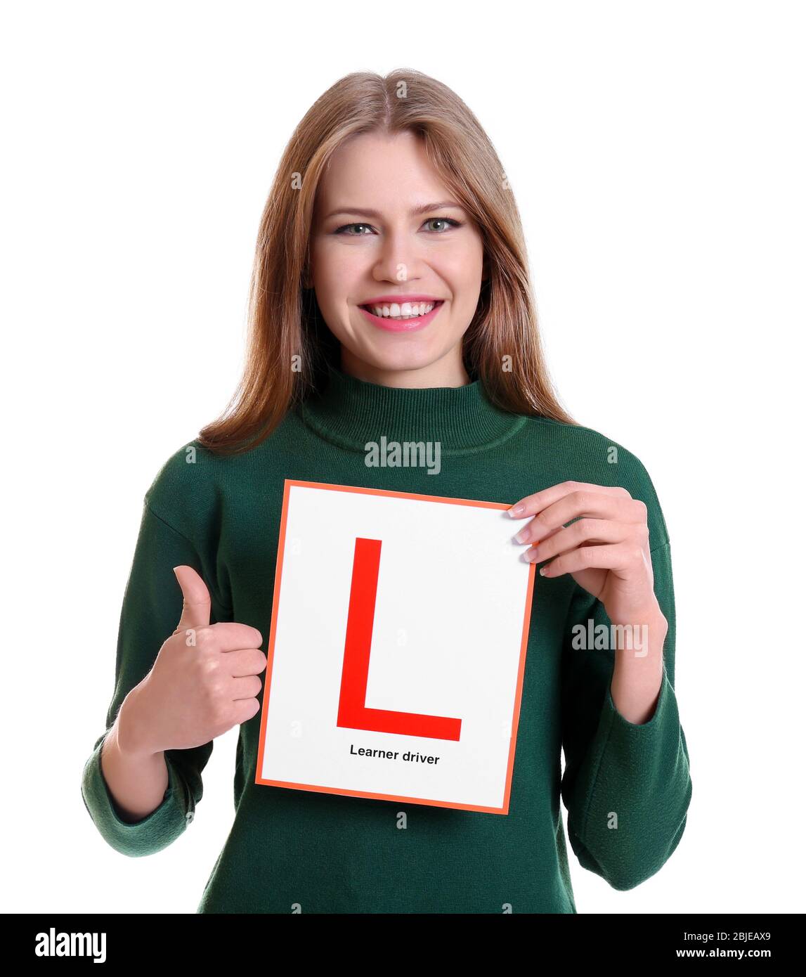 Young woman with learner driver sign on white background Stock Photo ...