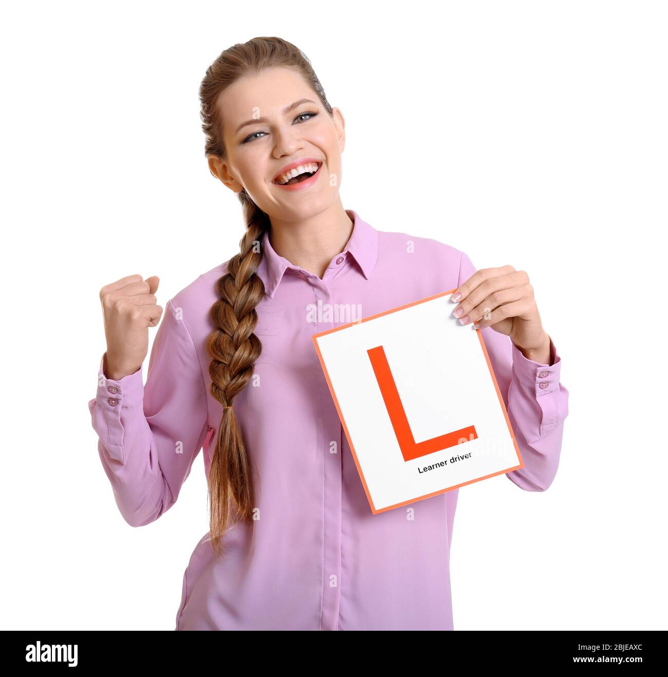 Young woman with learner driver sign on white background Stock Photo ...