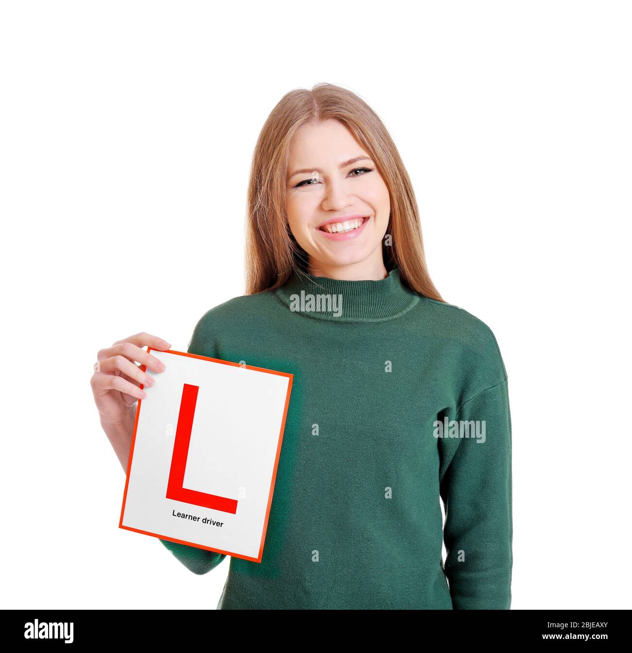 Young woman with learner driver sign on white background Stock Photo ...