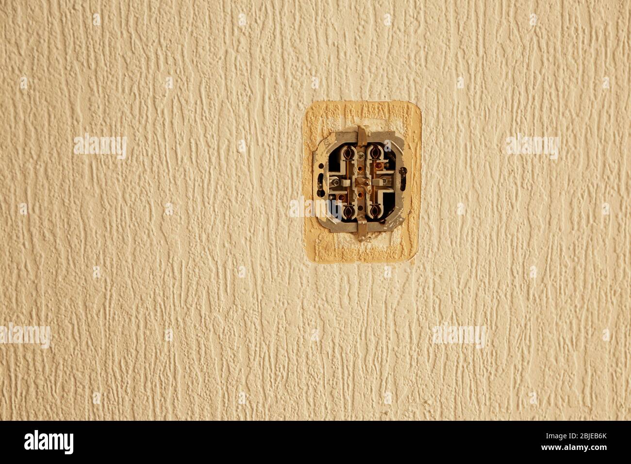 Disassembled socket in wall of new building Stock Photo - Alamy