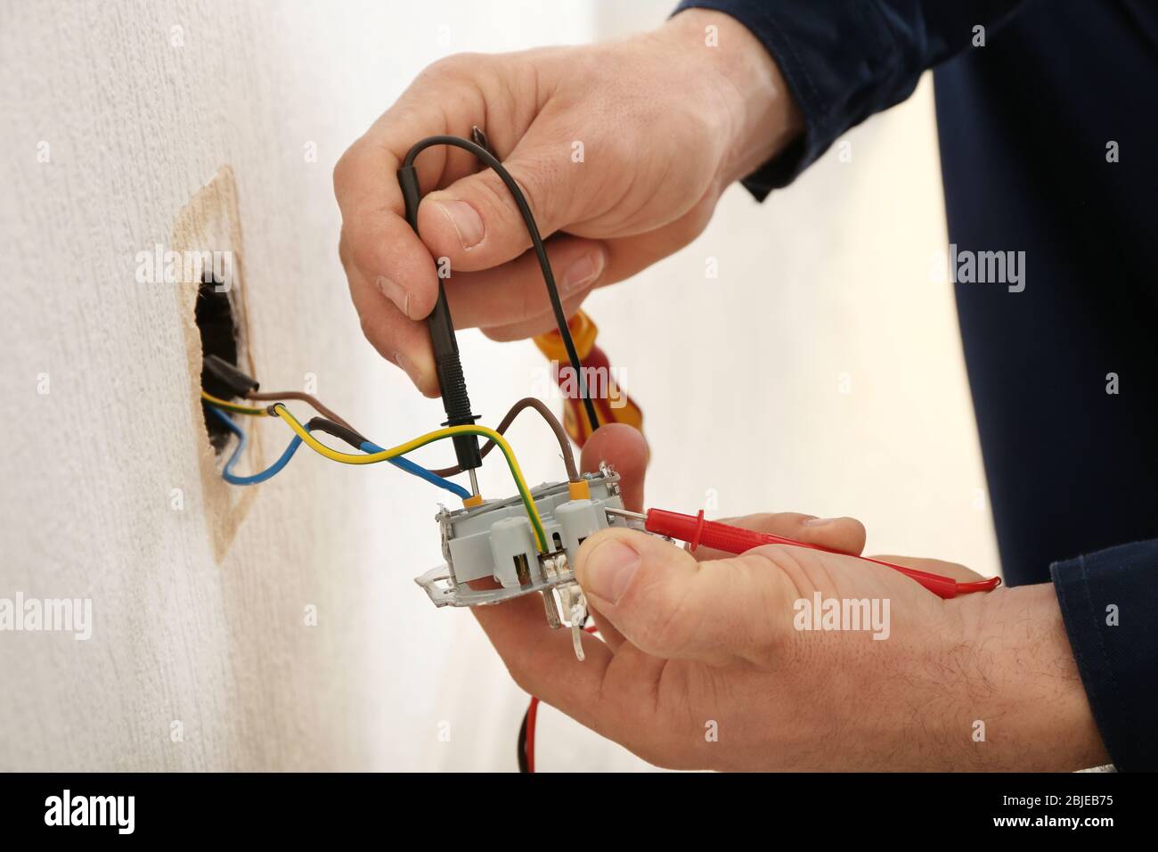 Attaching wires to wall hi-res stock photography and images - Alamy