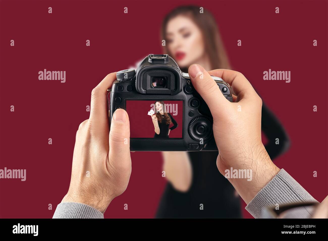 Digital single-lens reflex camera in hands. Photographer shooting hands ...