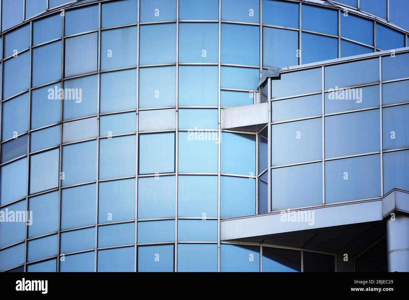 Modern building with glass facade, closeup Stock Photo - Alamy