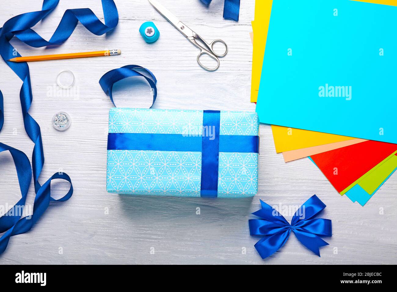 Process of gifts packing. Holiday concept Stock Photo - Alamy