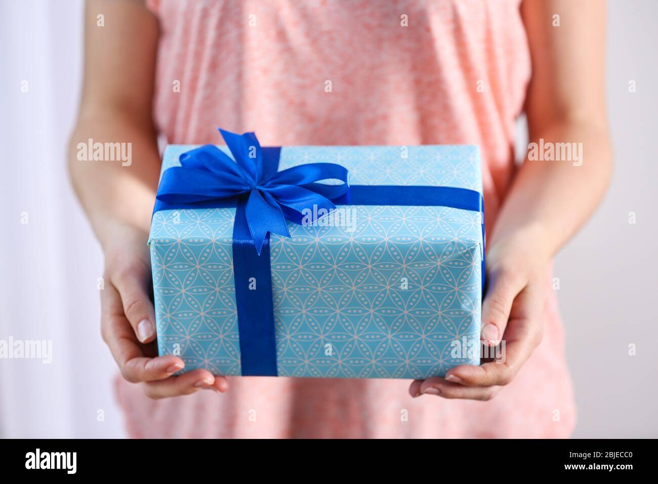 Female hands holding gift box, closeup Stock Photo - Alamy