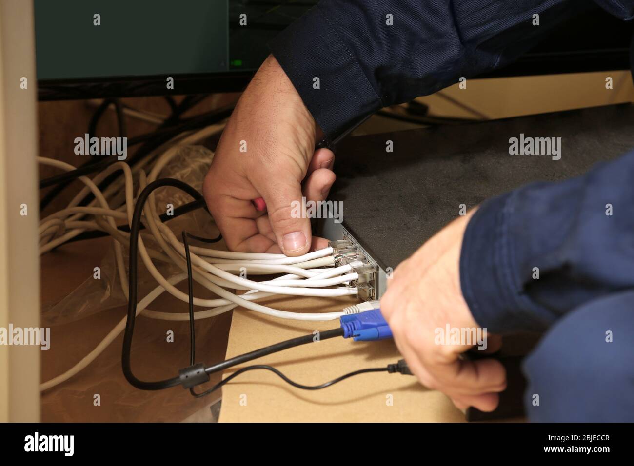 Electrician connecting CCTV system wires, closeup Stock Photo - Alamy