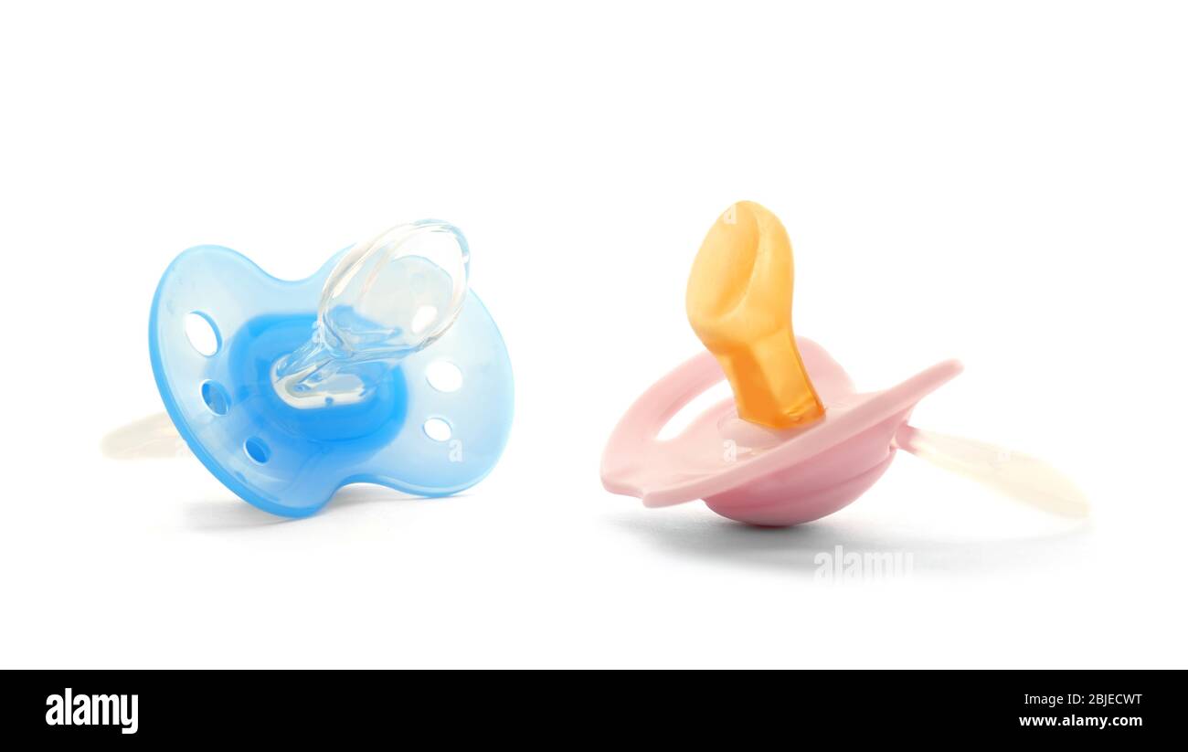 Baby pacifiers on white background Stock Photo - Alamy