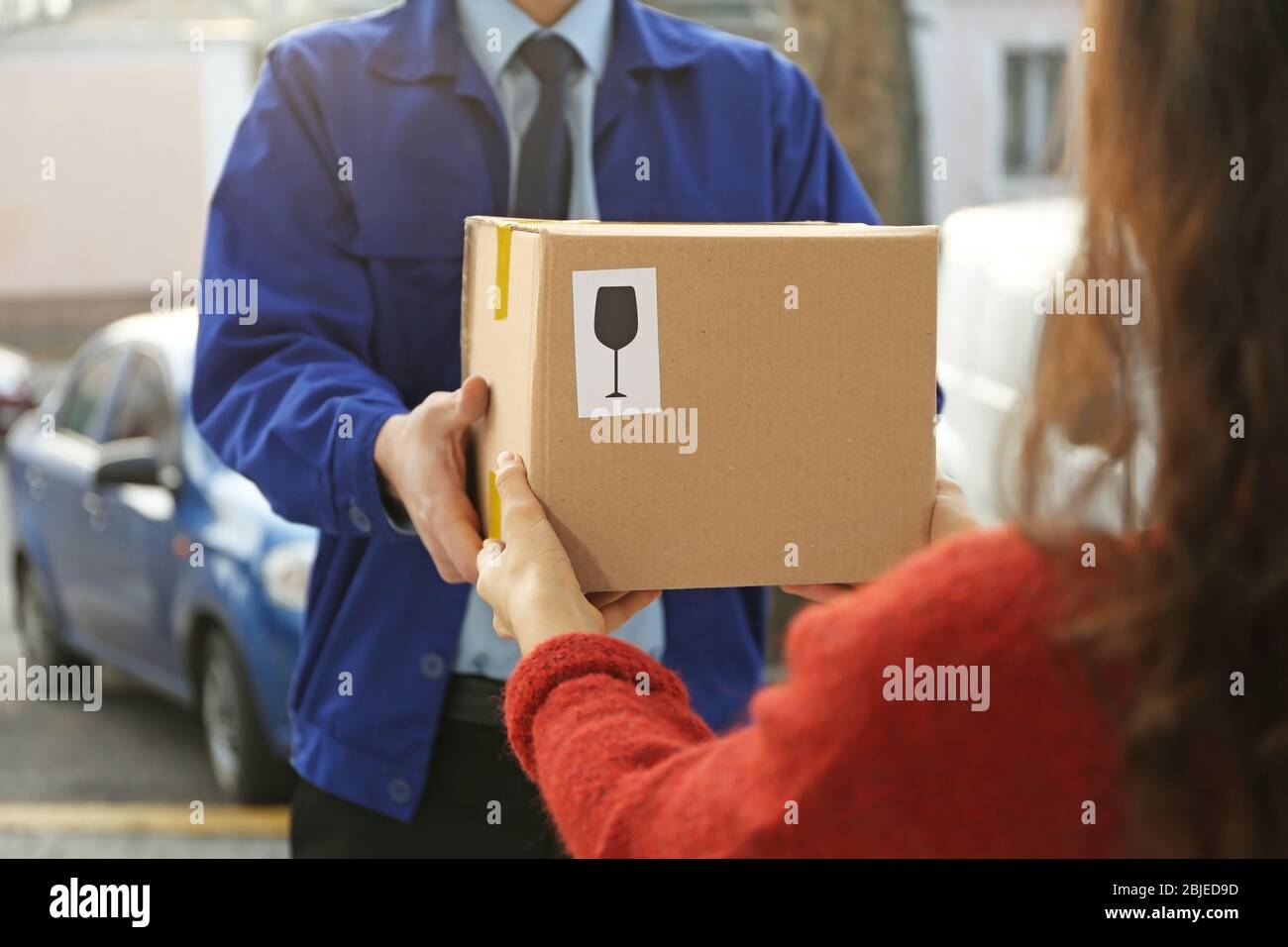 Hands giving parcel box customer hi-res stock photography and images ...