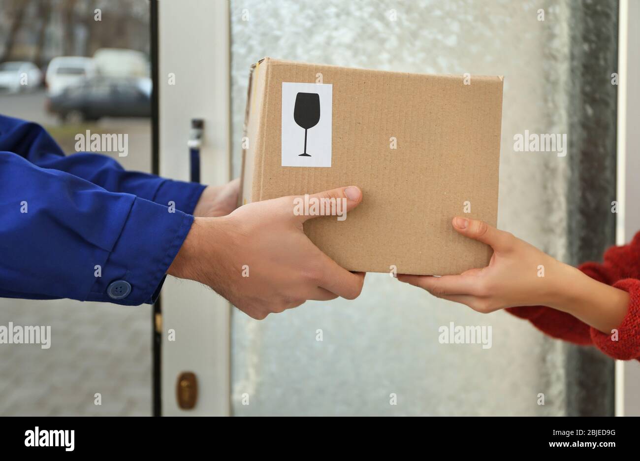 Hands giving parcel box customer hi-res stock photography and images ...