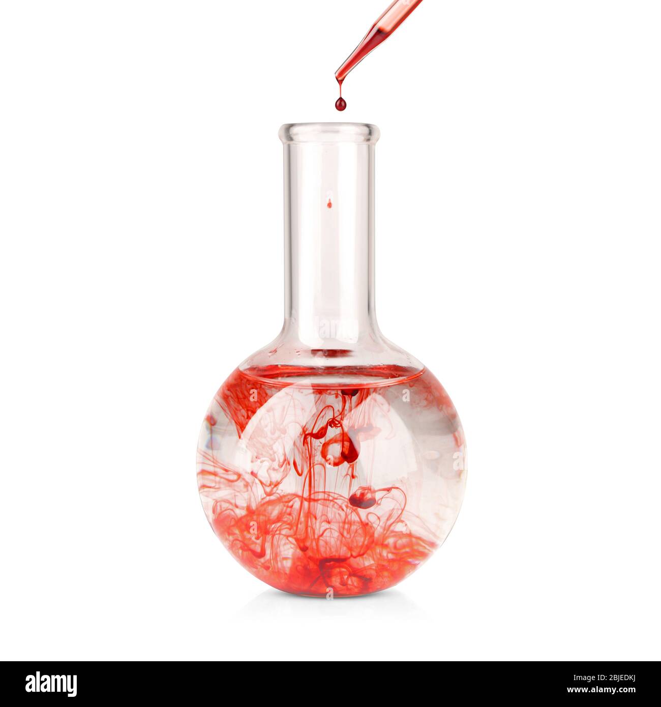 Pipette dropping a sample into a flask on white background Stock Photo ...