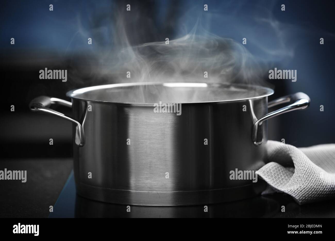 Steam over saucepan in the dark Stock Photo - Alamy