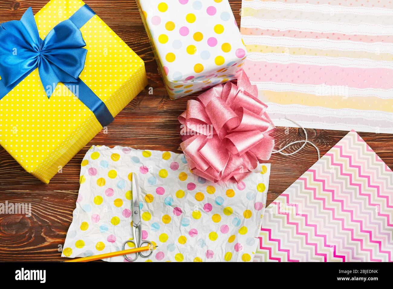 Process of gifts packing. Holiday concept Stock Photo - Alamy
