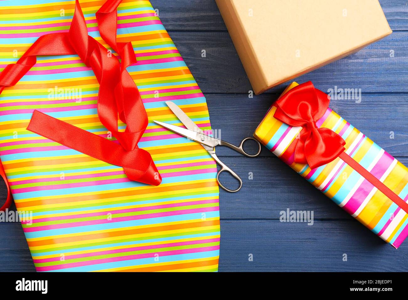 Process of gifts packing. Holiday concept Stock Photo - Alamy