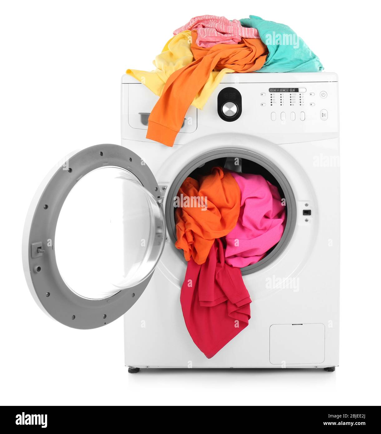 Clothes in washing machine on white background Stock Photo - Alamy