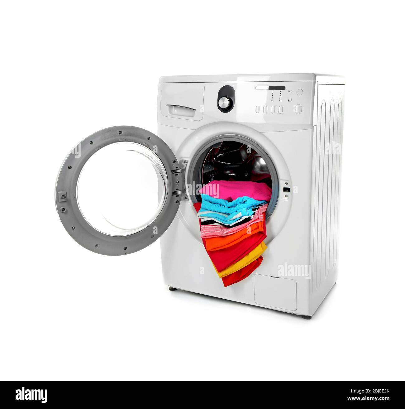 Clothes in washing machine on white background Stock Photo - Alamy