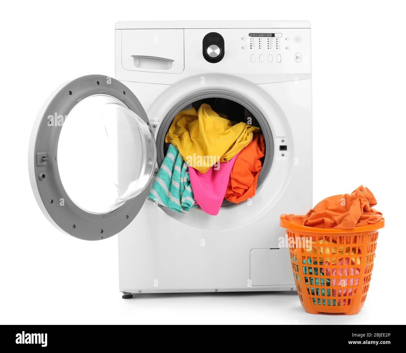 Clothes in washing machine on white background Stock Photo - Alamy
