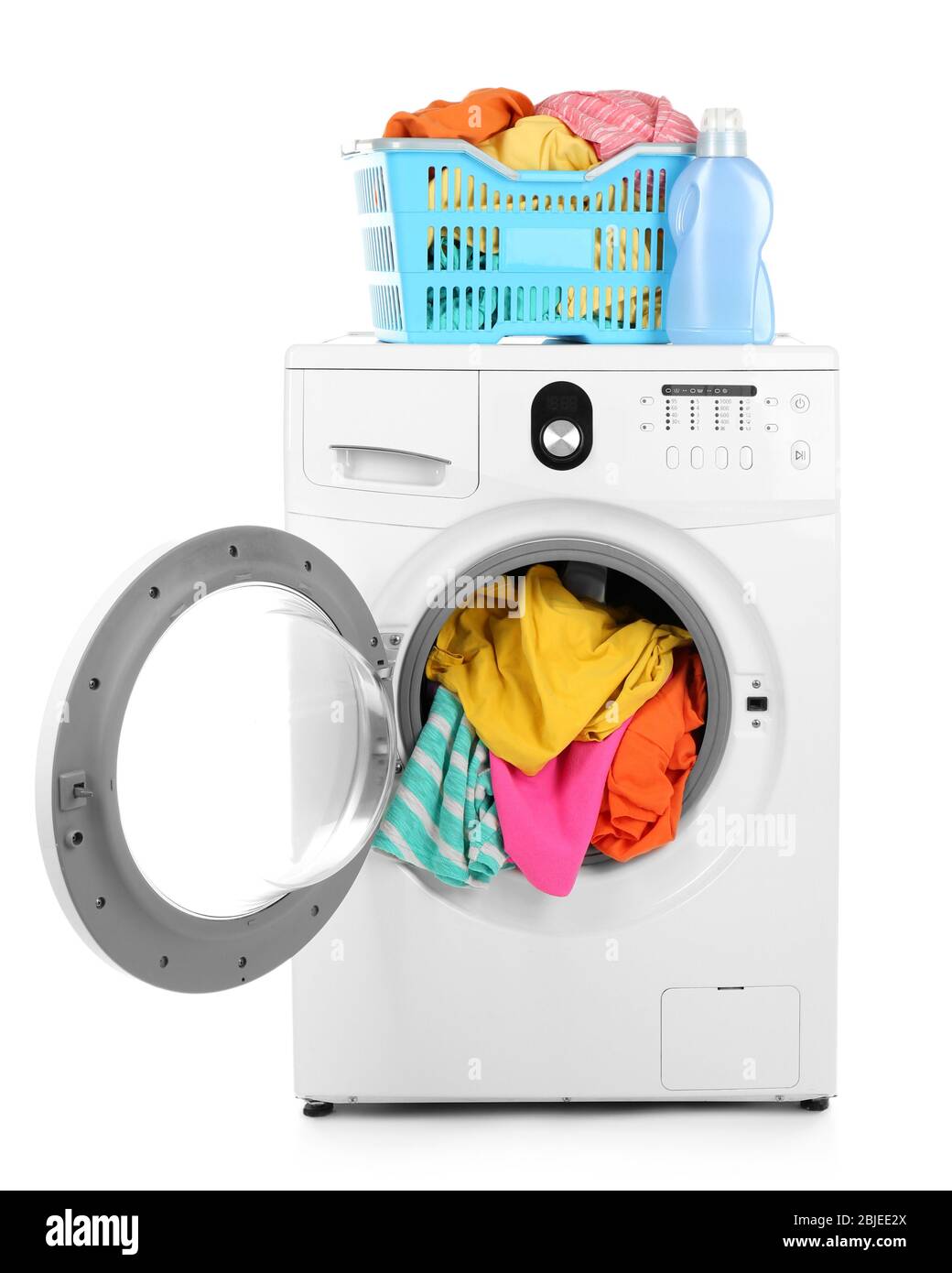 Clothes in washing machine on white background Stock Photo - Alamy