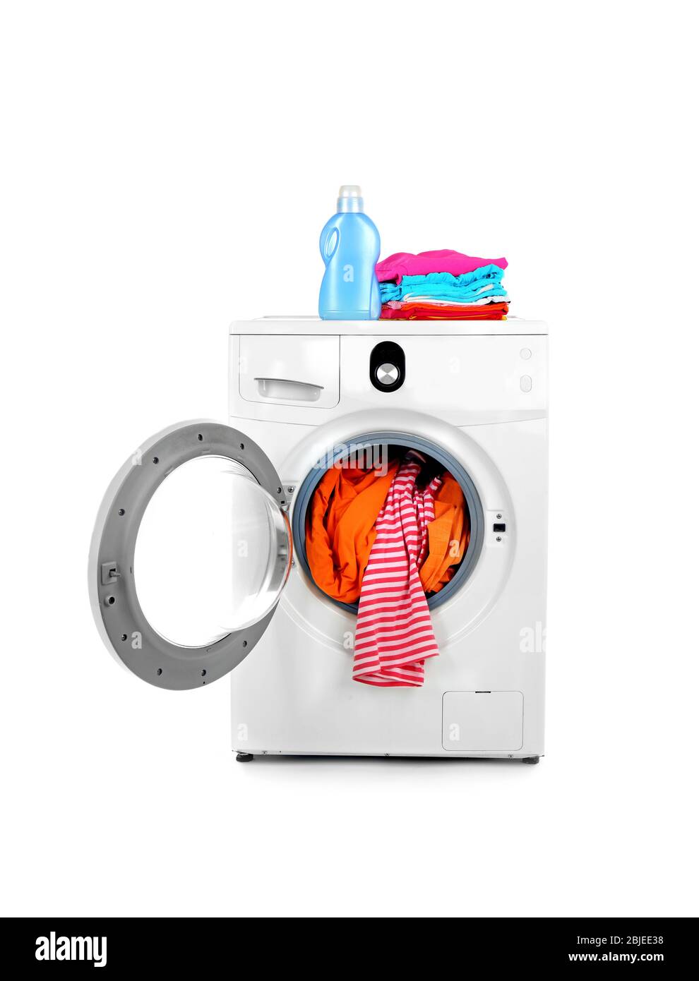 Clothes in washing machine on white background Stock Photo - Alamy