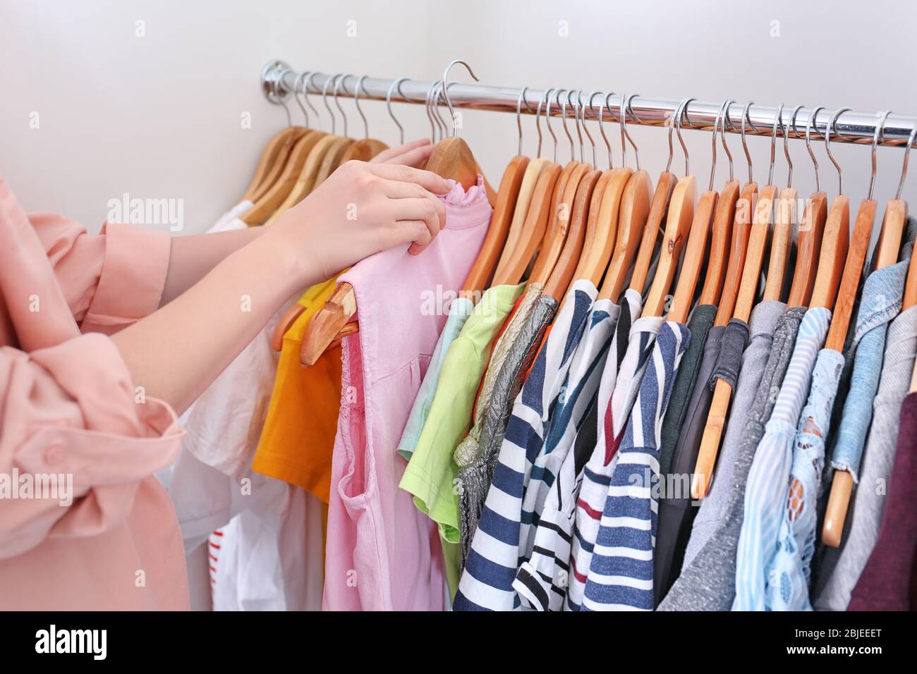 Closeup woman choosing clothes hi-res stock photography and images - Alamy