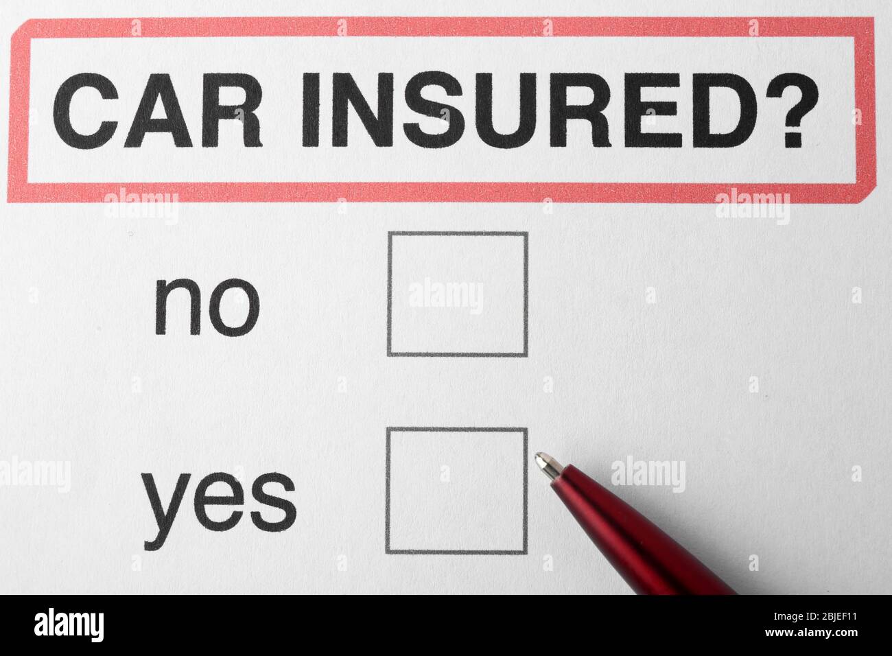 Car insurance concept. Pen on question form Stock Photo - Alamy