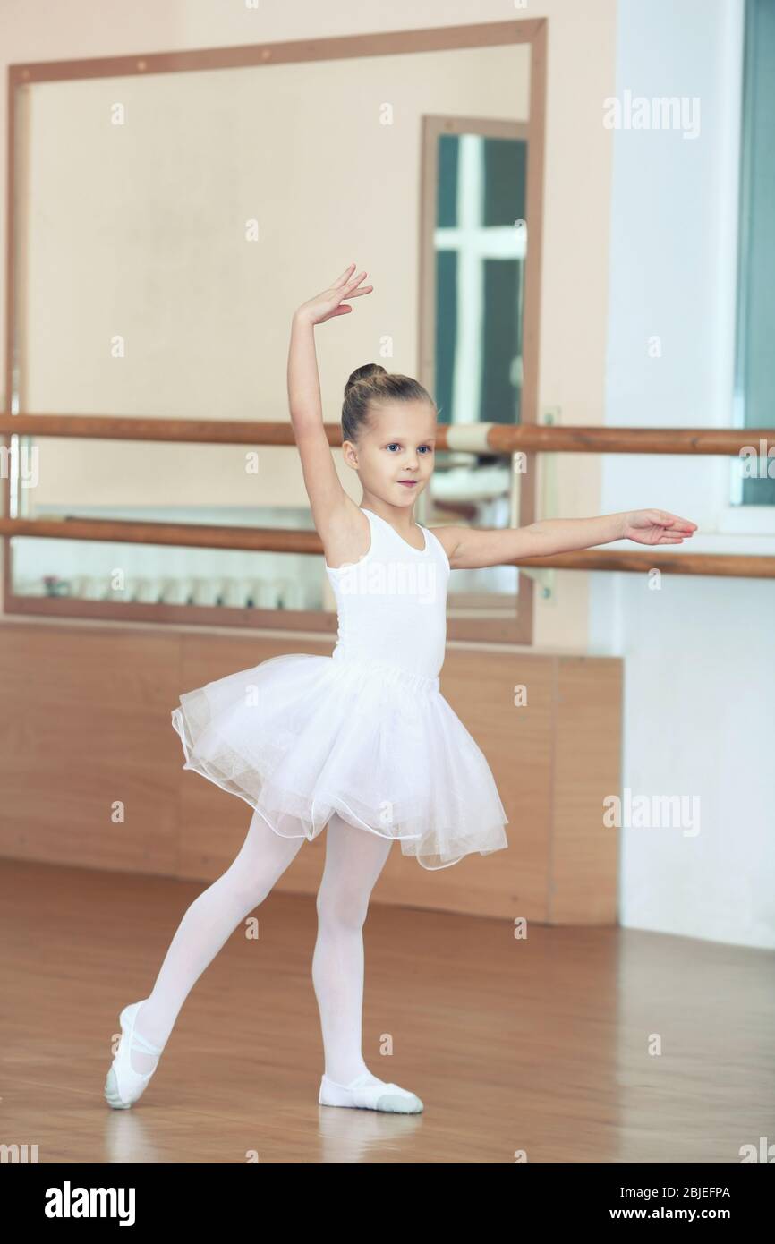Beautiful little girl practicing ballet at class Stock Photo - Alamy
