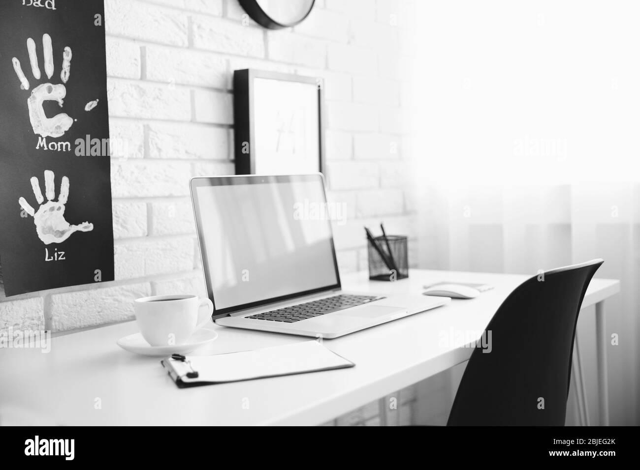 Cup laptop on table Black and White Stock Photos & Images - Alamy
