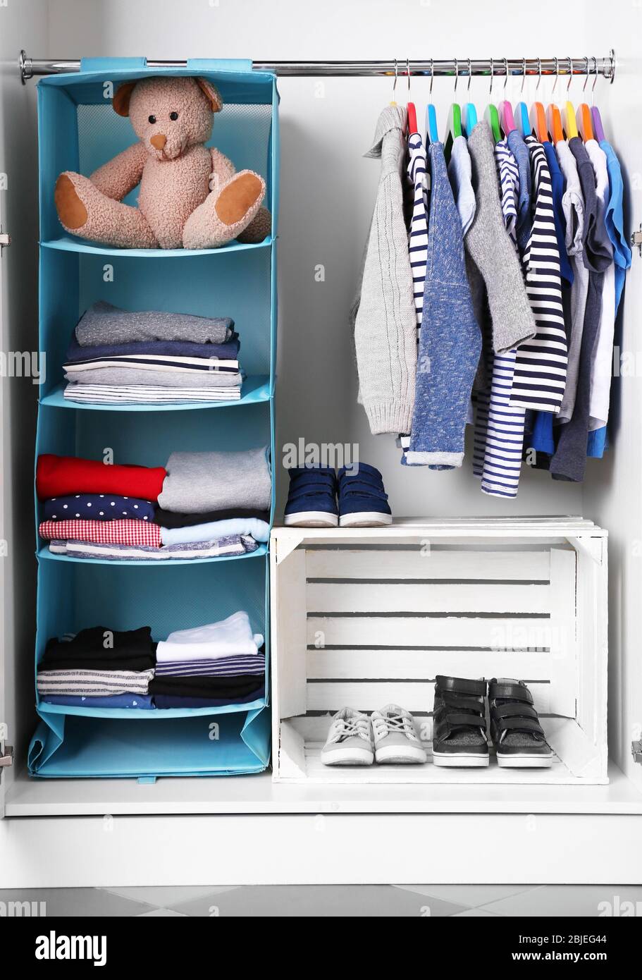 Wardrobe with kid clothes Stock Photo - Alamy