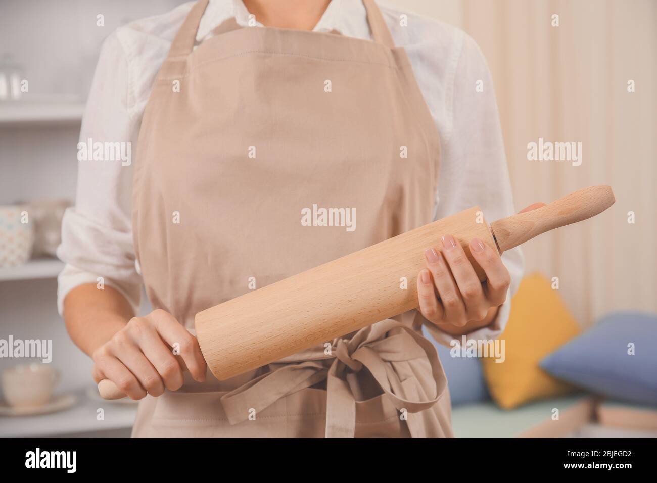 Woman holding rolling pin hi-res stock photography and images - Alamy