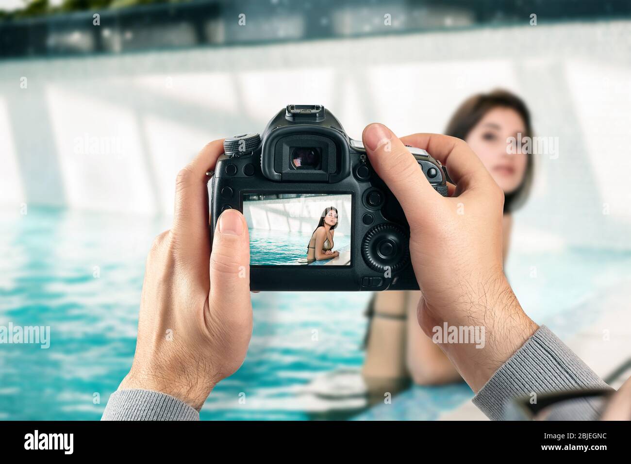 Digital single-lens reflex camera in hands. Photographer shooting hands ...