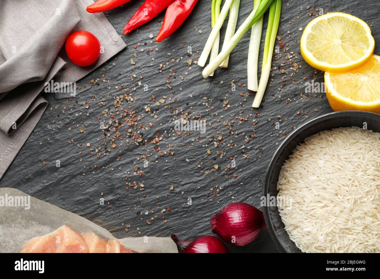 Rice and other products on dark background Stock Photo - Alamy