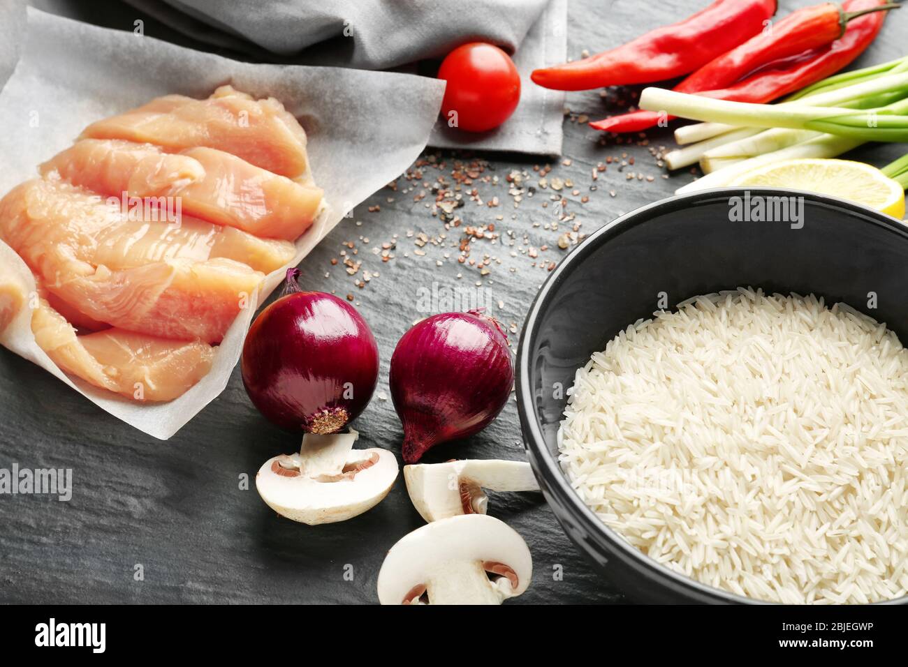Rice and other products on dark background Stock Photo - Alamy