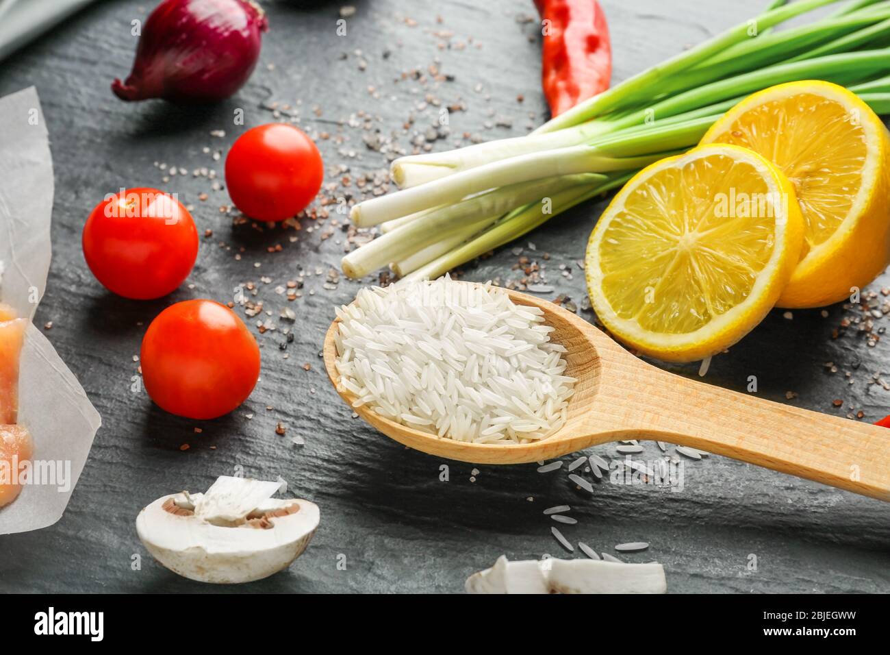 Rice and other products on dark background Stock Photo - Alamy