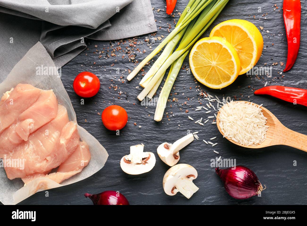 Rice and other products on dark background Stock Photo - Alamy