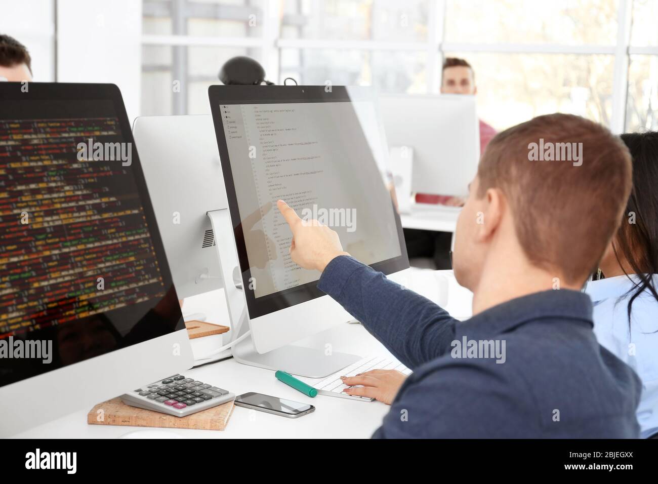 Young people software programmers hi-res stock photography and images ...