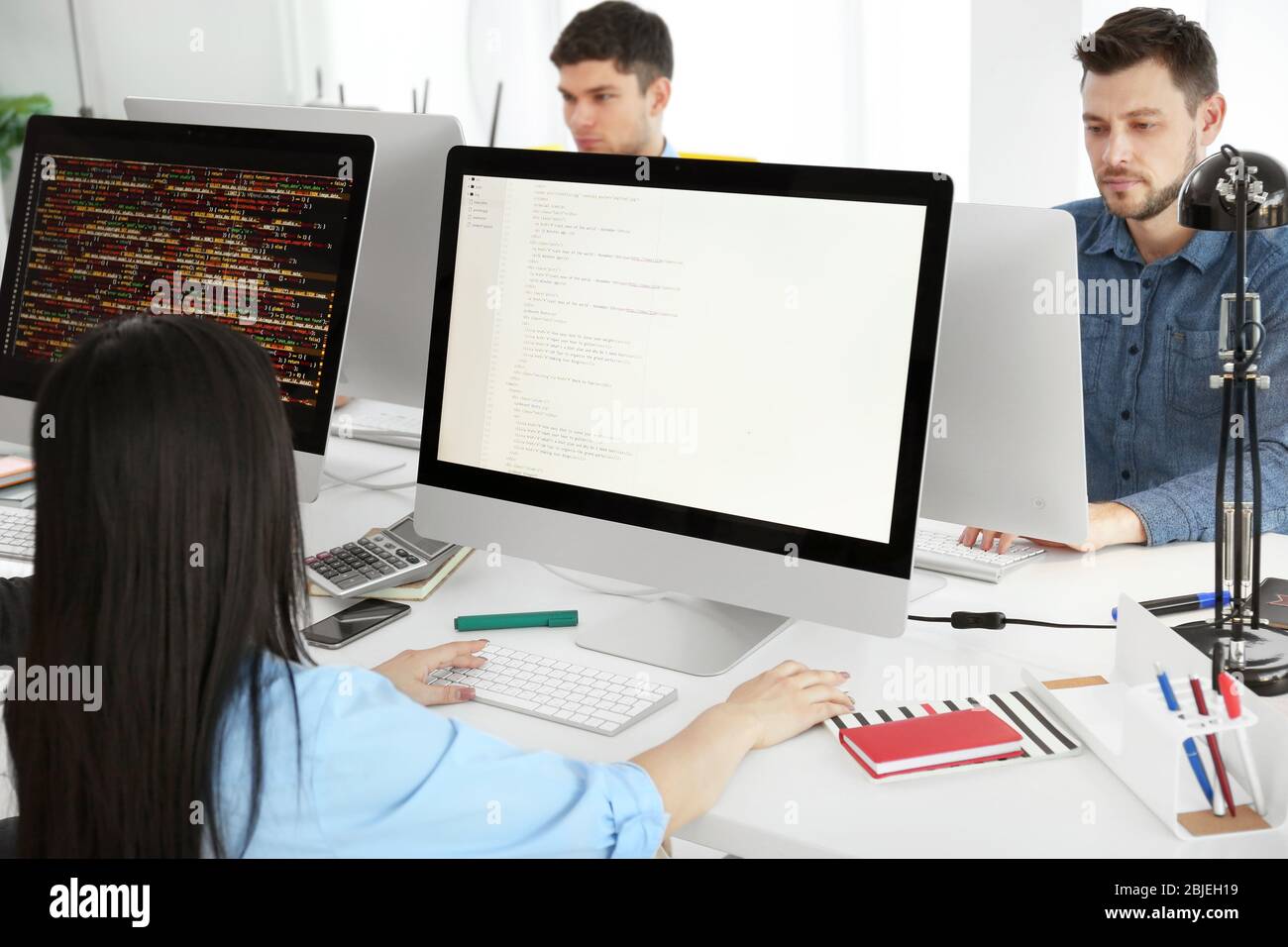 Female programmers working table hi-res stock photography and images - Alamy