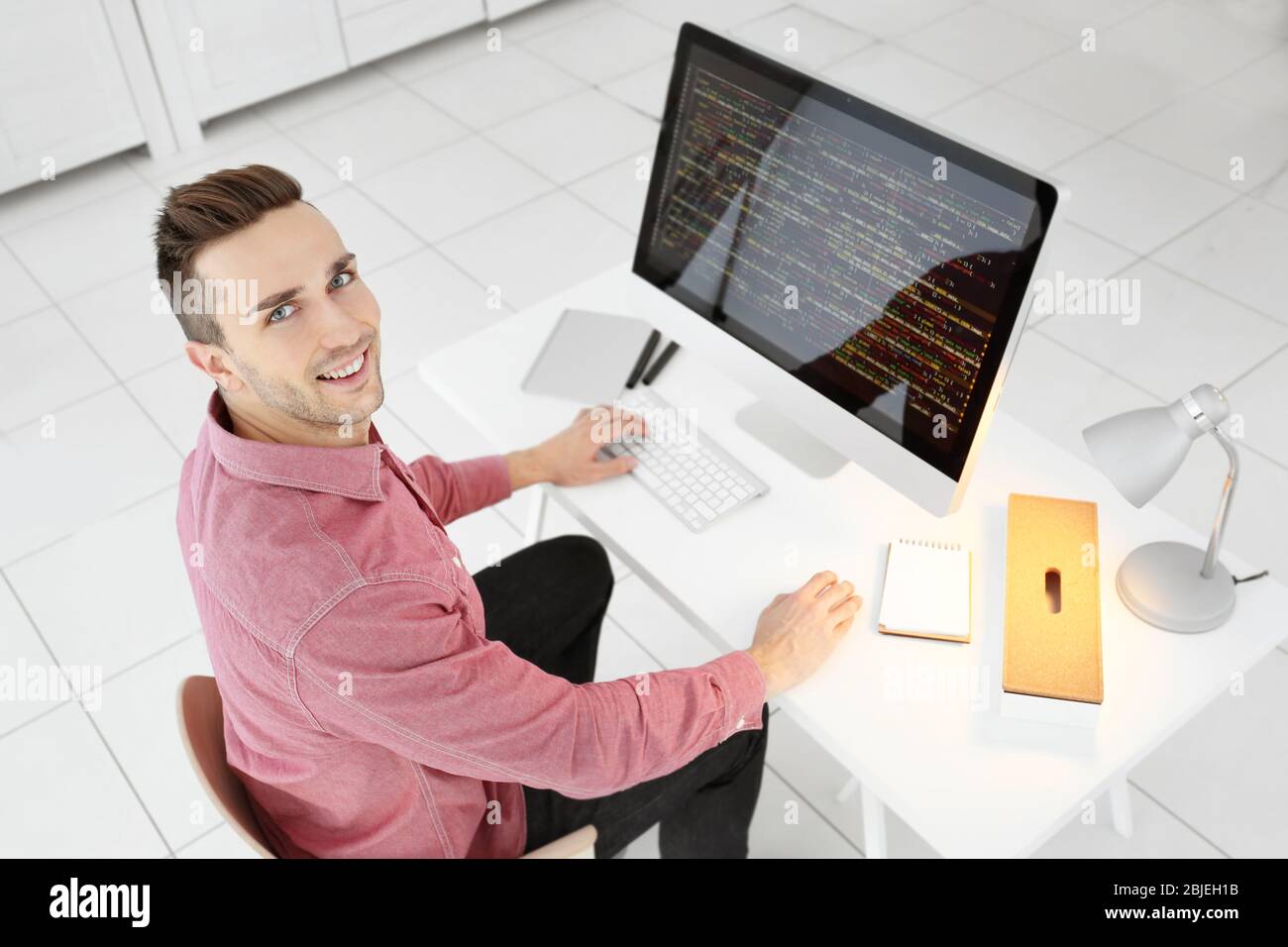 Handsome hard working programmer hi-res stock photography and images ...