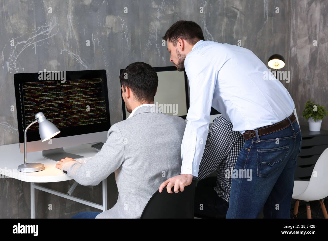 Young programmers hi-res stock photography and images - Alamy