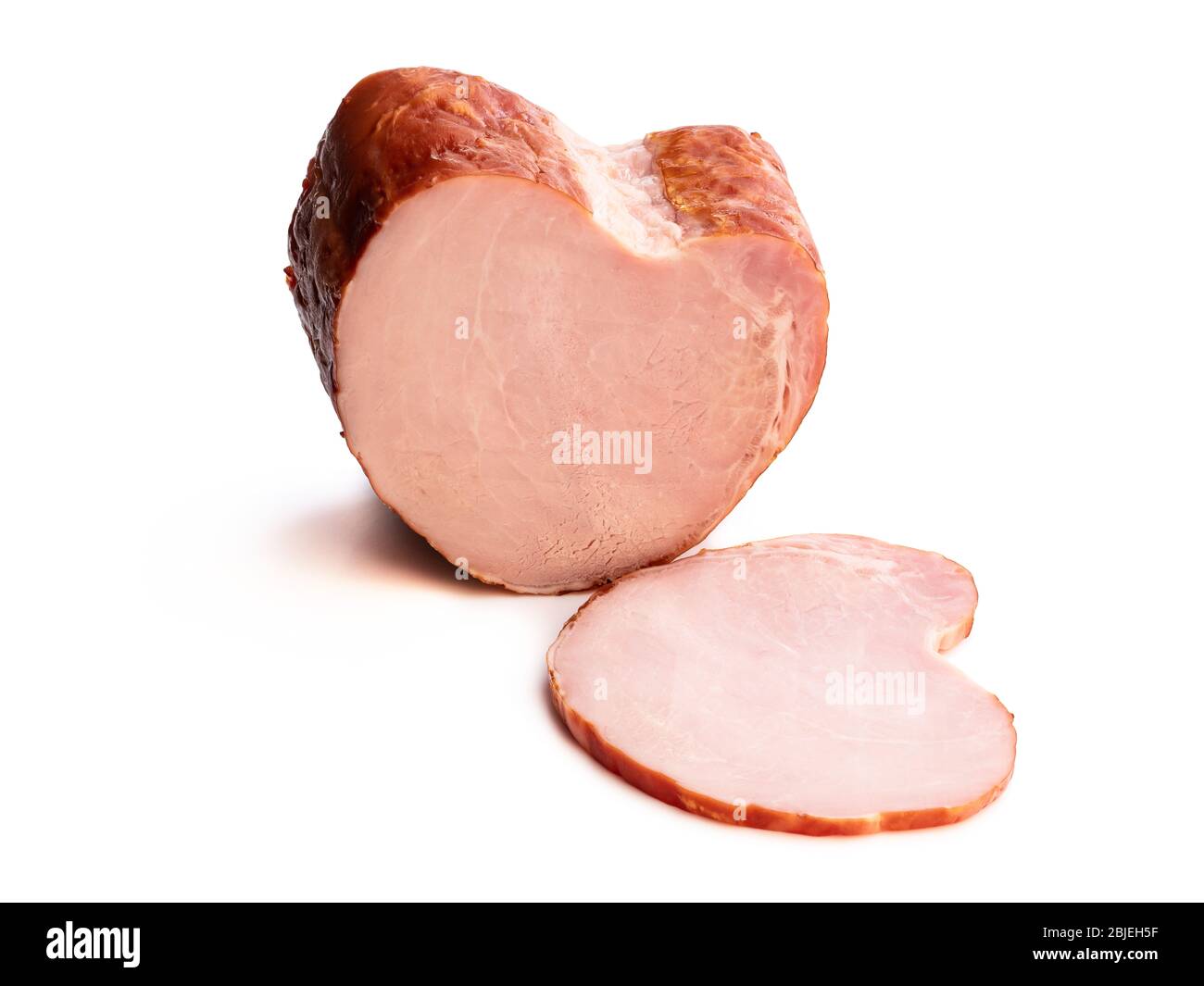 Heart shaped smoked pork loin isolated on white Stock Photo - Alamy
