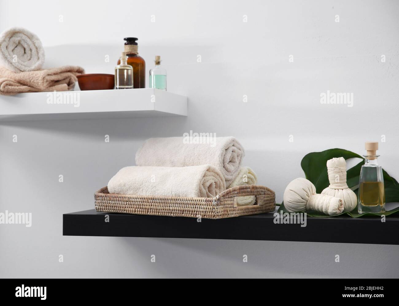 Shelves with spa stuff on white background Stock Photo - Alamy