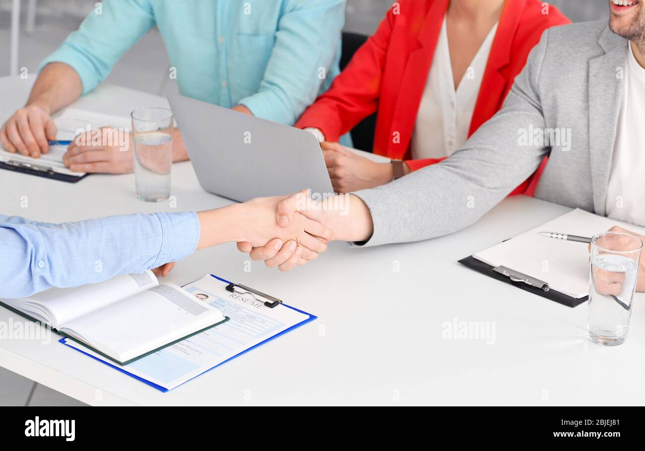 Job interview concept. HR manager shaking female hand in office Stock ...