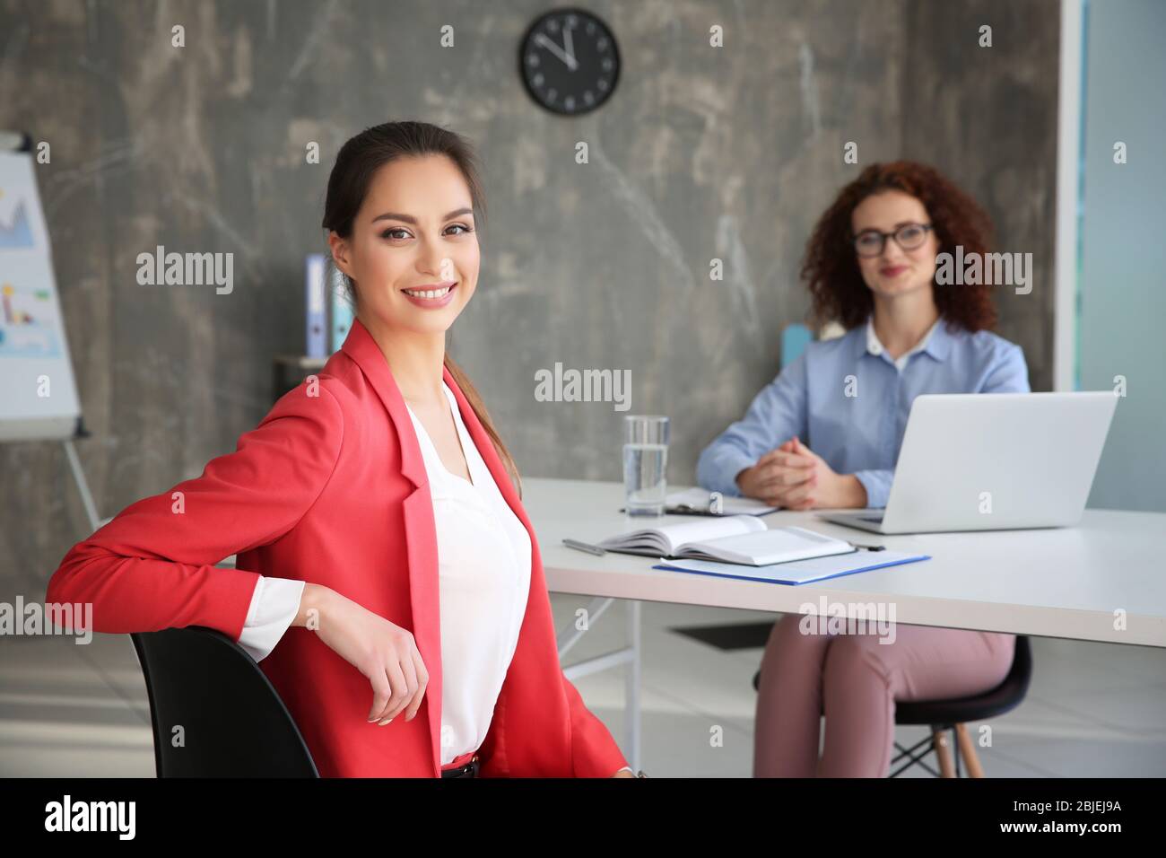 Job interview concept. HR manager interviewing woman Stock Photo - Alamy
