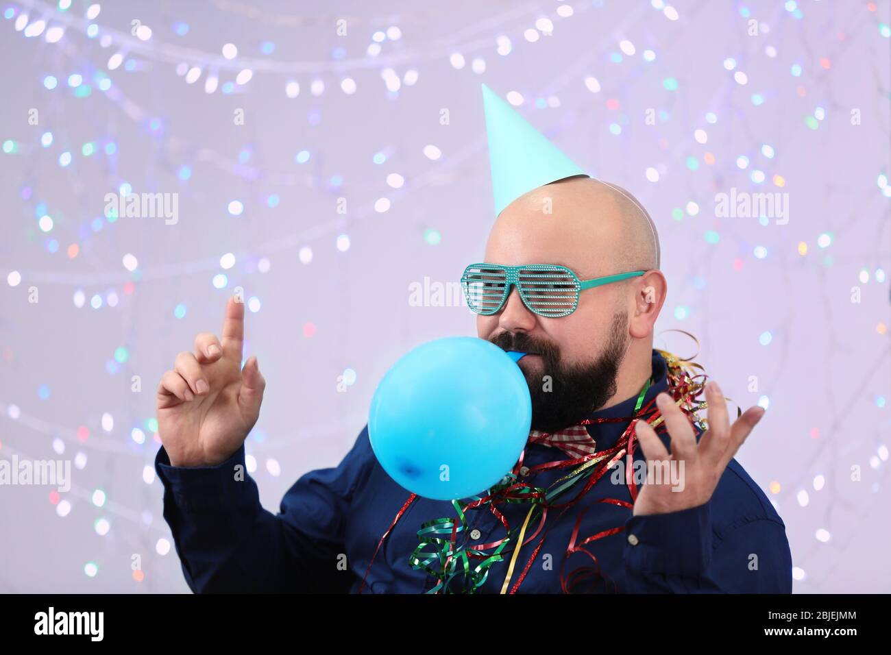 Man inflating balloon hi-res stock photography and images - Alamy