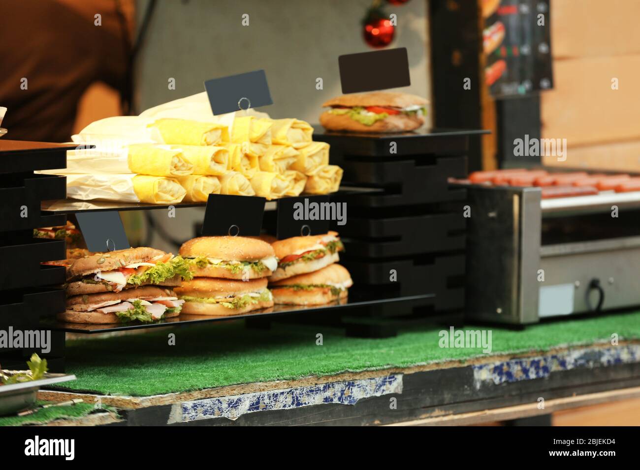 Different types of street food on counter Stock Photo - Alamy