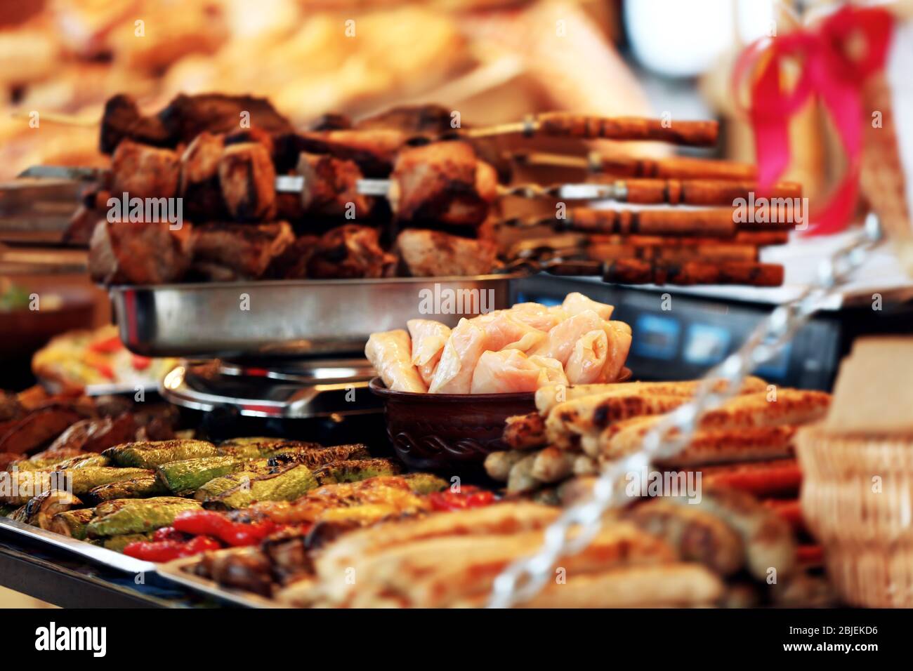 Trays with different kinds of food on counter Stock Photo - Alamy